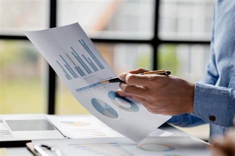Premium Photo Businessman Holding Financial Documents He Owns A