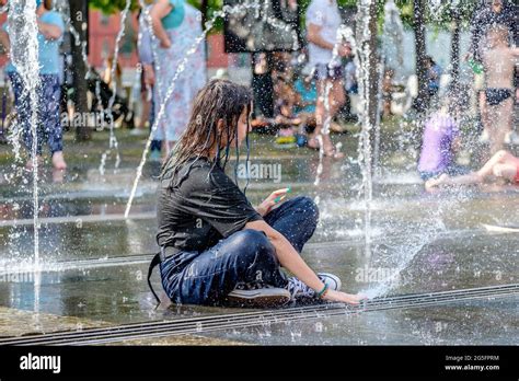 Moscow Russia June 26 2021 A Young Girl In Wet Clothes Sits On The