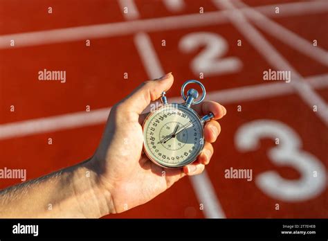 Stopwatch In Hand Track Numbers Background Timing Sports