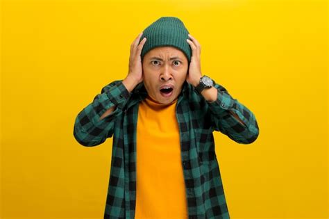 Premium Photo Scared And Anxious Asian Man Appears Panicked Holding