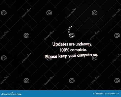 computer update screen with progress message and loading symbol stock