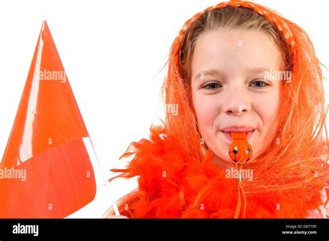 Girl Is Posing In Orange Outfit For Soccer Game Over White Background