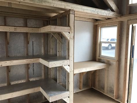 The Inside Of A Storage Room With Shelves And Shelving In Place For