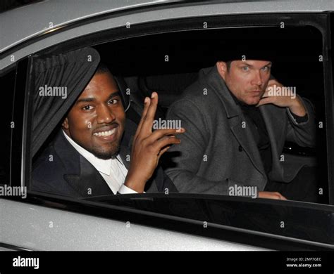 Exclusive Kanye West Flashes The Peace Sign In His Luxury Silver Car