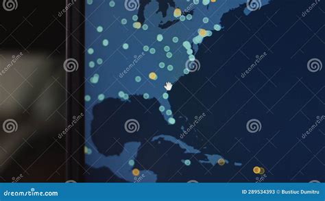 Criminal Hacker Using Computer Pointing To A World Map For Organizing