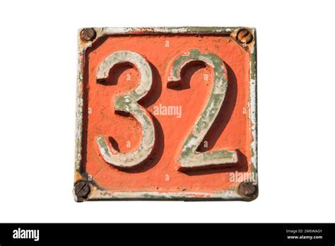 Old Retro Weathered Cast Iron Plate With Number 32 Closeup Isolated On