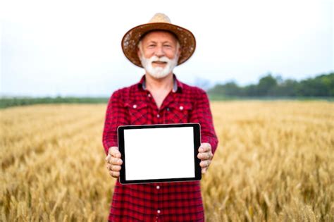 Premium Photo Man Using Smart Farming Application On Digital Tablet