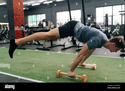 Male Gymnast Doing Tagged Out Handstand Strong Muscular Fit Man