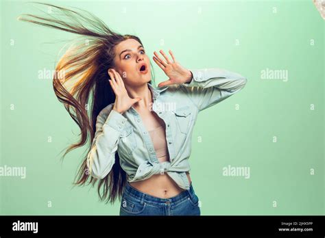Portrait Of Young Emotive Girl In Casual Clothes Posing With Shocked