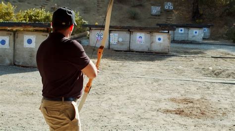 Side View Of Woman Shooting Bow Arrow · Free Stock Video