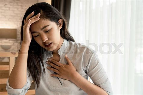 Portrait Of 20s Young Asian Woman Having Difficulty Breathing In