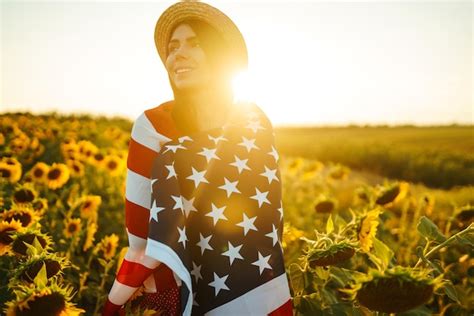 Premium Photo Beautiful Girl In Hat With American Flag In A Sunflower