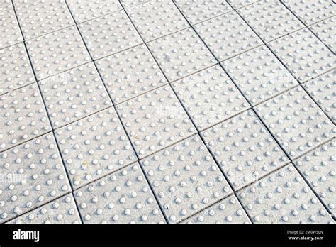 Geometric Pattern Of Grey Floor Tiles With Anti Slippery Structure In