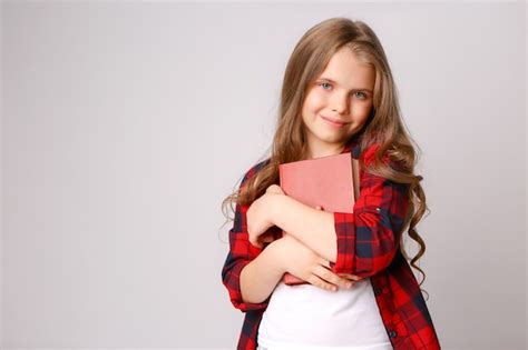 Premium Photo Girl Hugging Book