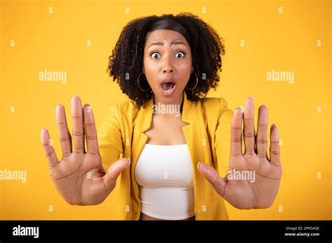 Shocked Black Lady Showing Stop Gesture At Camera Refusing Something