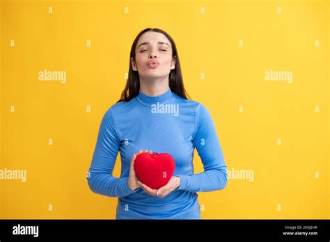 Beautiful Girl Holding Valentines T On Yellow Background Portrait
