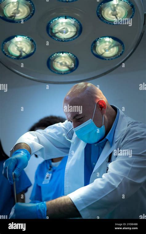 A Medical Professor Is Teaching Surgery To Medical Students Working