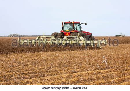 A Case Ih Tractor And Field Implement Prepare A Field In Late Spring