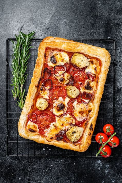 Homemade Puff Pastry Pizza With Salami Mozzarella Tomatoes And Cheese