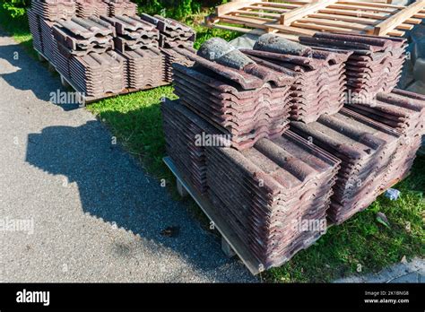 Old Dismantled Roof Shingles After Replacement Neatly Stacked On