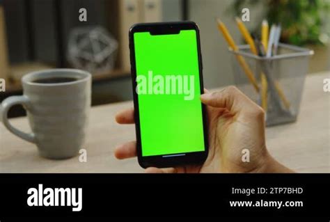Black Smart Phone In Caucasian Mans Hands Vertically Fingers Scrolling