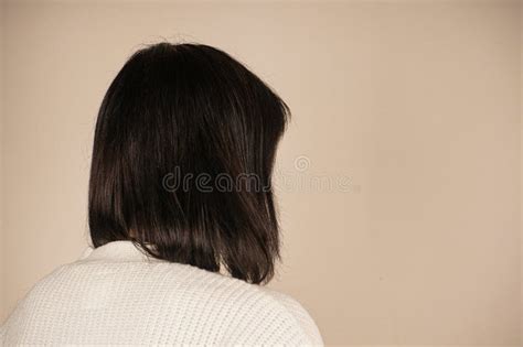 The Black Bob Is Neatly Flowing When Viewed From Behind Showcasing Its