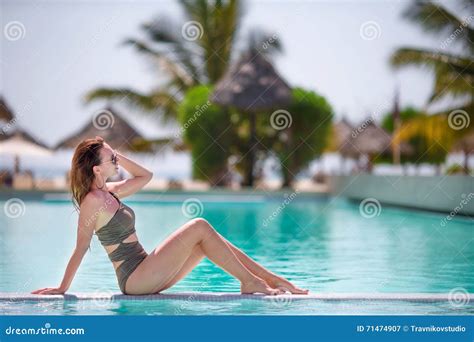 Young Woman Enjoying Water And Rest In Outdoor Swimming Pool Stock