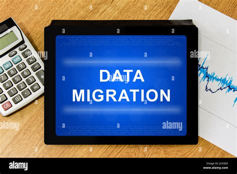 Data Migration Word On Digital Tablet With Calculator And Financial