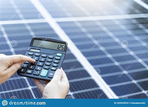 Energy Saving Concept With Solar Panels And A Calculator Stock Image
