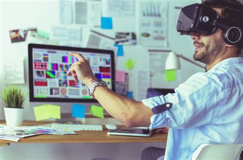 Young Male Software Programmer Testing A New App With 3d Virtual