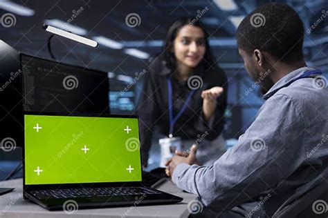 Close Up Of Chroma Key Notebook Used By Workers Overseeing Data Center