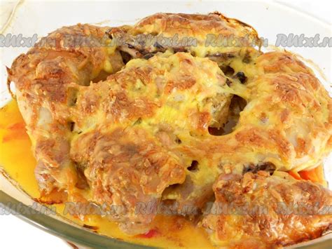 Курица под сыром в духовке 8 фото в рецепте