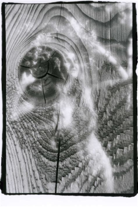 A Naked Girl With A Wreath On Her Head And A Saw Cut From A Beam Stock