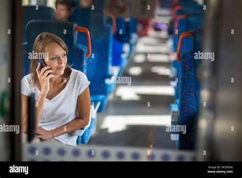 Pretty Young Woman Boarding A Trainhaving Arrived To Her Destination