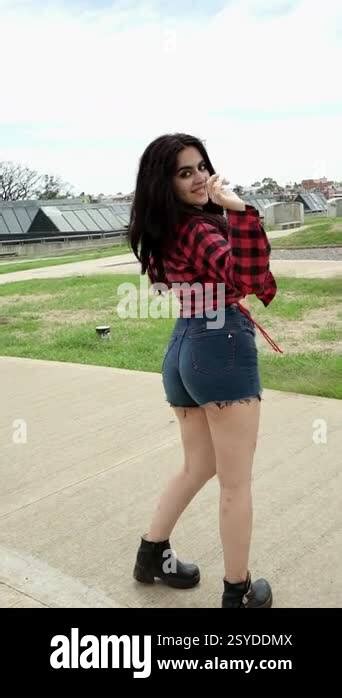 Young Woman Dancing Outdoors In Red Lumberjack Shirt Stock Video
