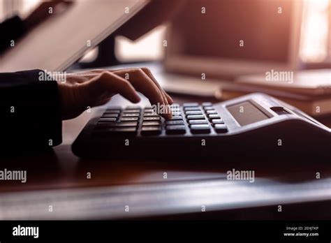 Business Women Working With Calculator And Business Document On Office Table In Office Finance