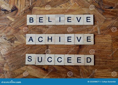 Believe Achieve Succeed Text On Wooden Square Motivation Quotes Stock