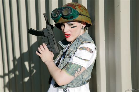 Tattooed Chick With Shaved Head In Army Gear Giving Man In Ape Mask A BJ Porn Pictures XXX