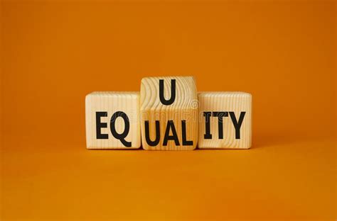 Equity And Equality Symbol Turned Wooden Cubes With Words Equality And