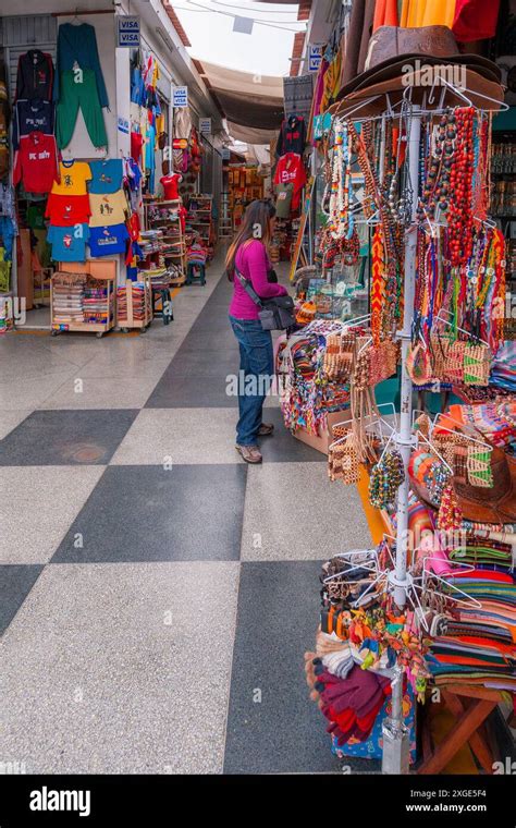 12OCT2008 Lima Peru Woman Looks At The Display Of Various Souvenir