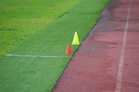 Artificial Track And Field With Green Grass Combined With Artificial
