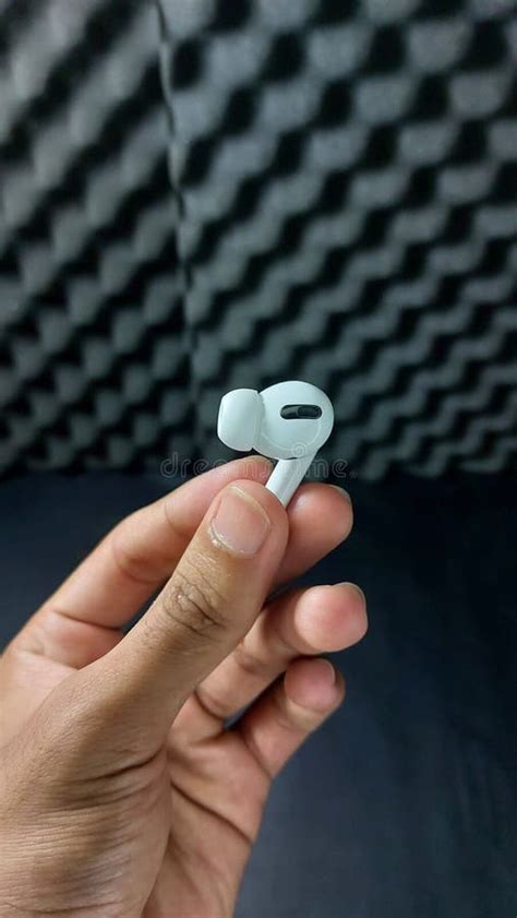Wireless White Bluetooth Earphones With Contactless Charging Isolated Close Up On A Background