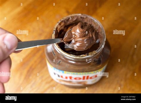 Bavaria Germany March 17 2024 A Man Takes A Spoonful Of Nutella