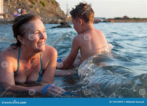 Grandmother With Her Grandson Bathing In The Sea Stock Image Image Of