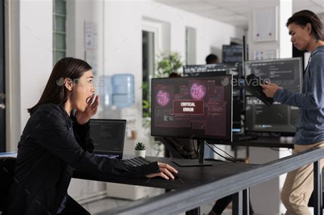 Asian App Developer Having Web Server Hacked Stock Photo By Dc Studio