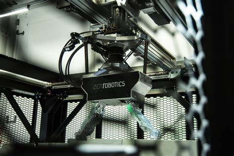 4 View Of A Zenrobotics Heavy Picker Robotic Arm Through A Safety Cage