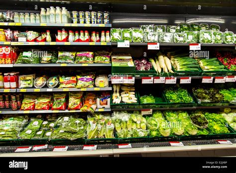 Shelf With Food In A Supermarket Refrigerated Fruit Juices Salad