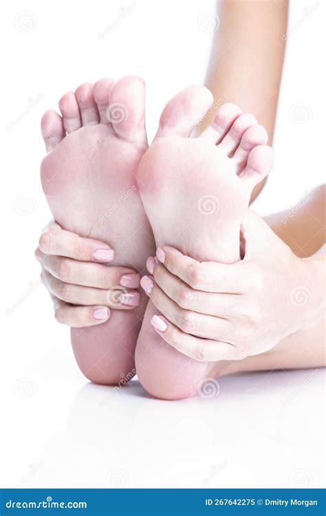 View Of Soft And Beautiful Female Foot While Hands Touching Heels Over