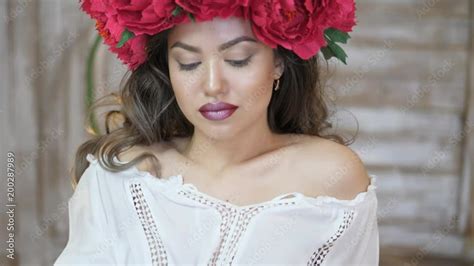 Girl Posing In Front Of Camera Young Woman In A Wreath Of Scarlet