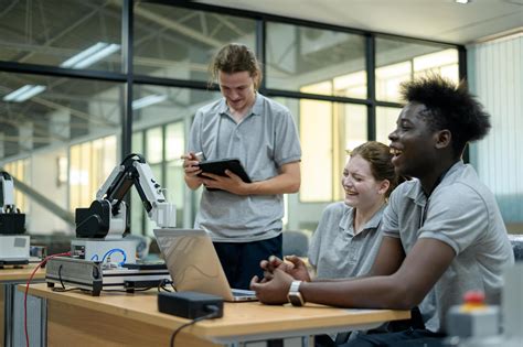 Trainee Robotics Engineer Learning With Programming And Manipulating